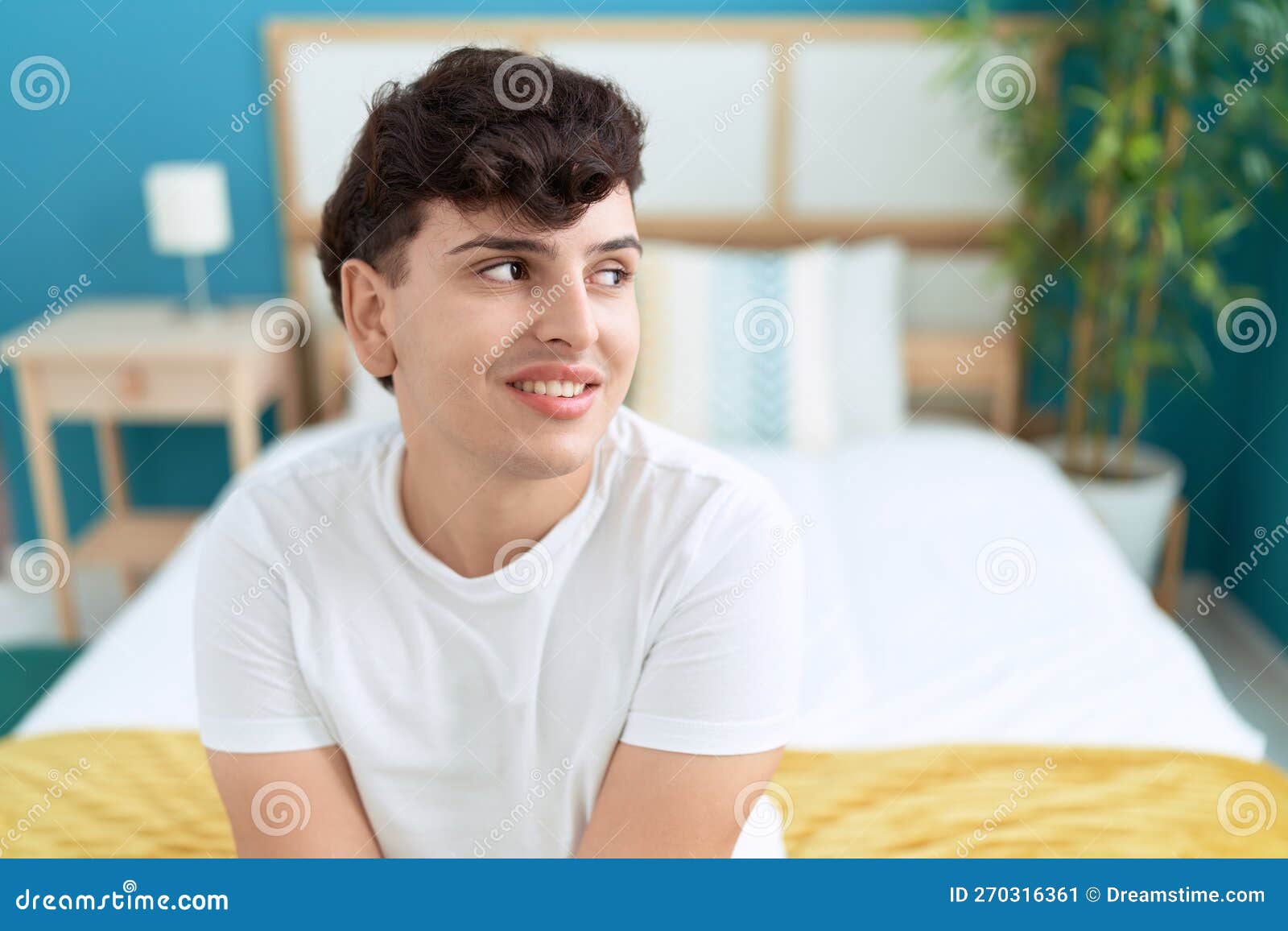 Non Binary Man Smiling Confident Sitting on Bed at Bedroom Stock Image ...