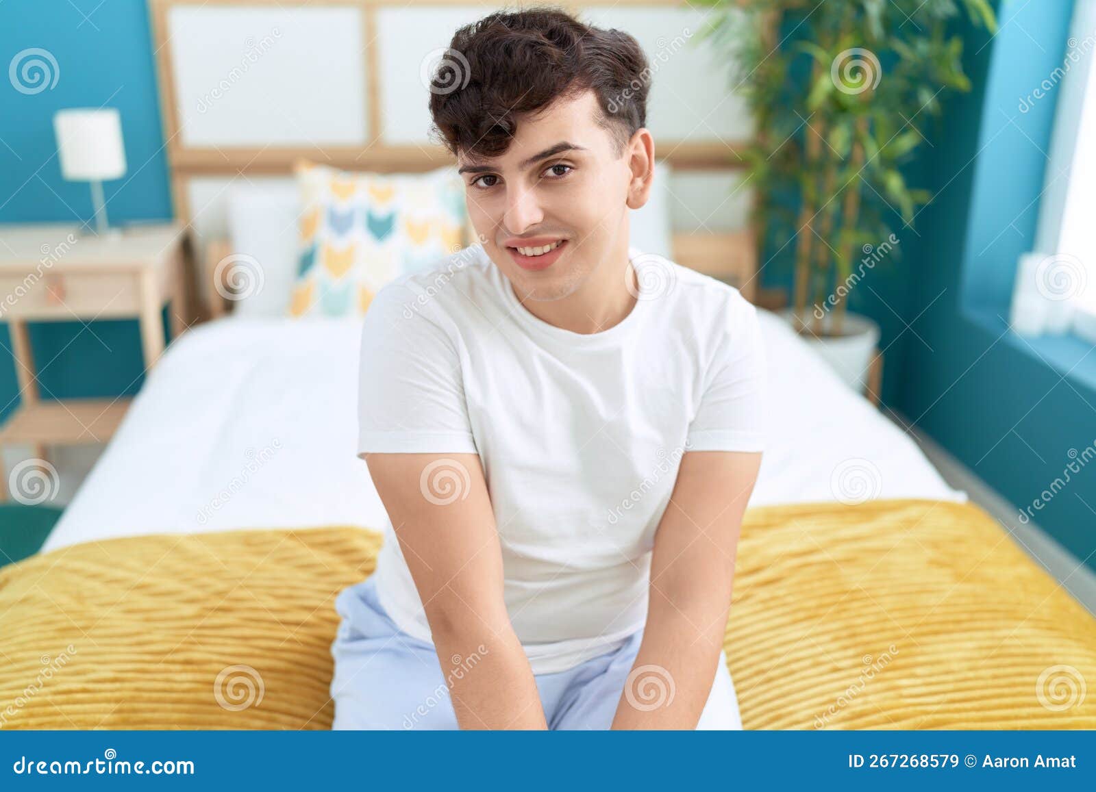 Non Binary Man Smiling Confident Sitting on Bed at Bedroom Stock Image ...