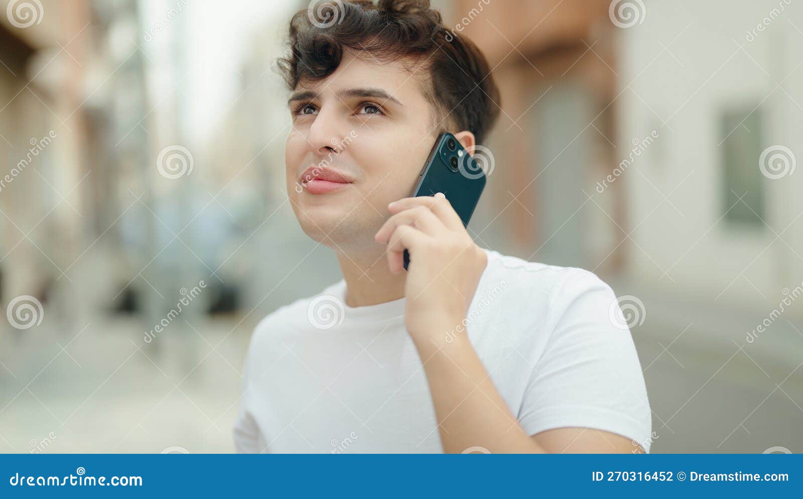 Non Binary Man Smiling Confident Talking on Smartphone at Street Stock ...