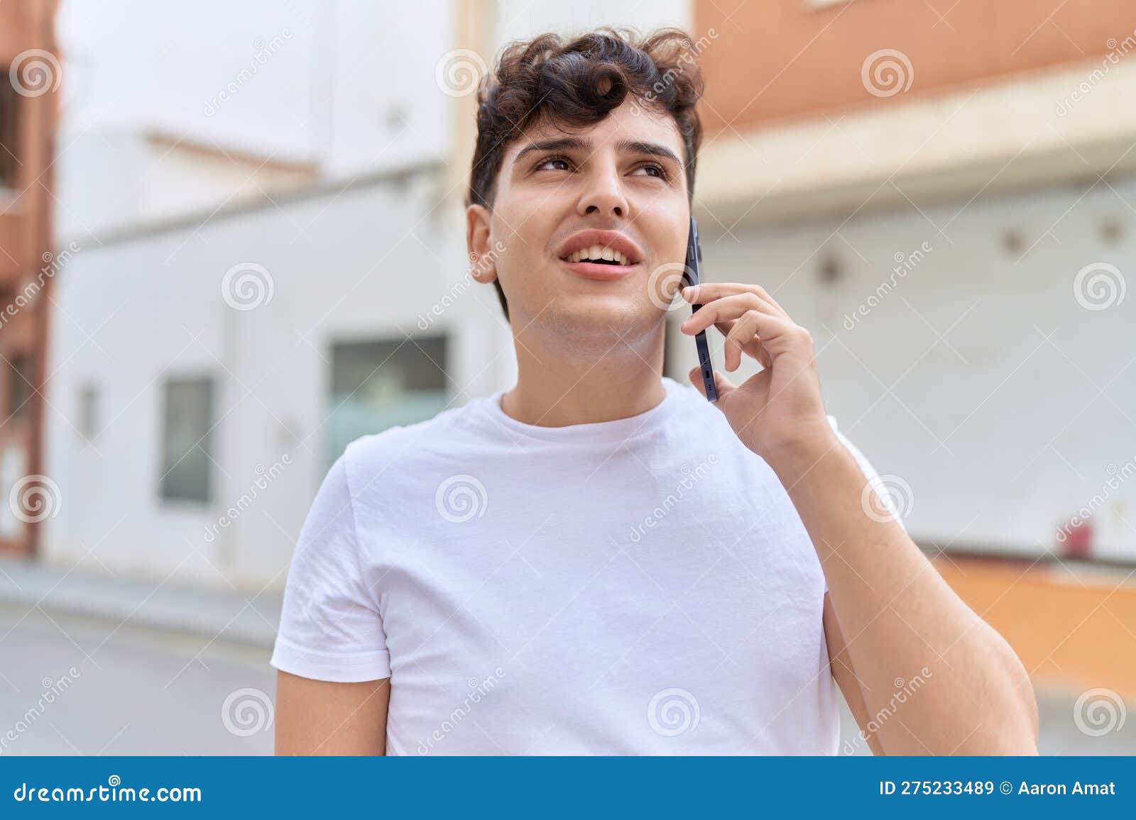 Non Binary Man Smiling Confident Talking on Smartphone at Street Stock ...