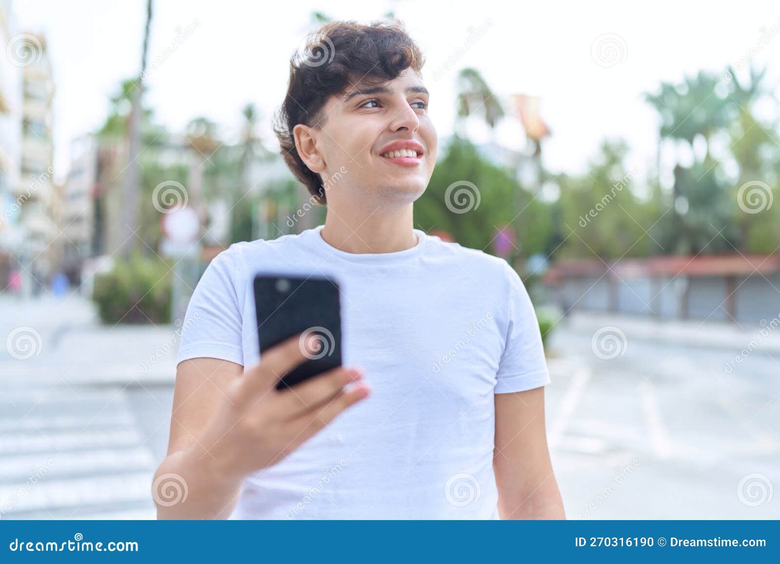 Non Binary Man Smiling Confident Using Smartphone at Street Stock Photo ...