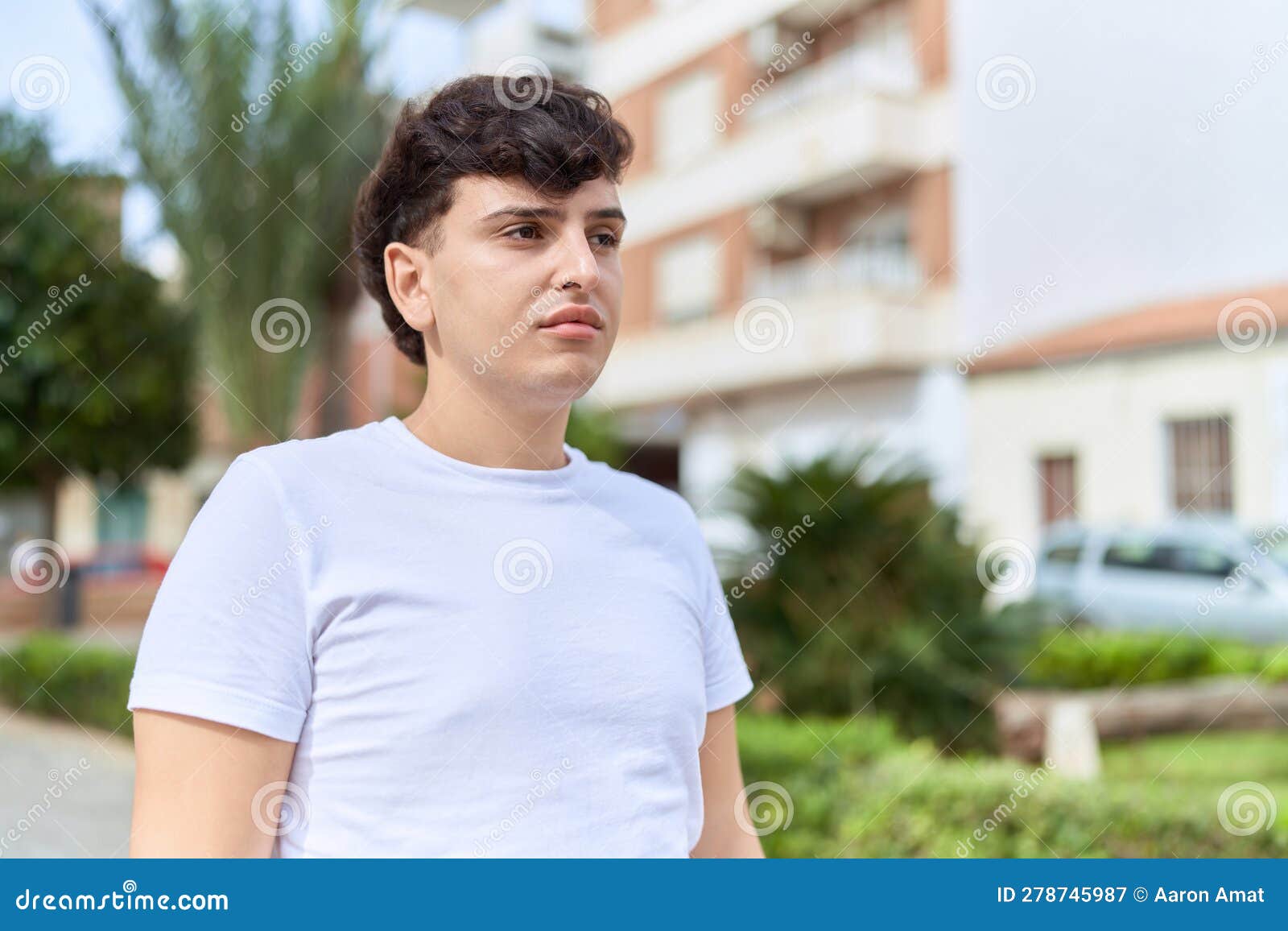 Non Binary Man Standing with Serious Expression at Park Stock Image ...