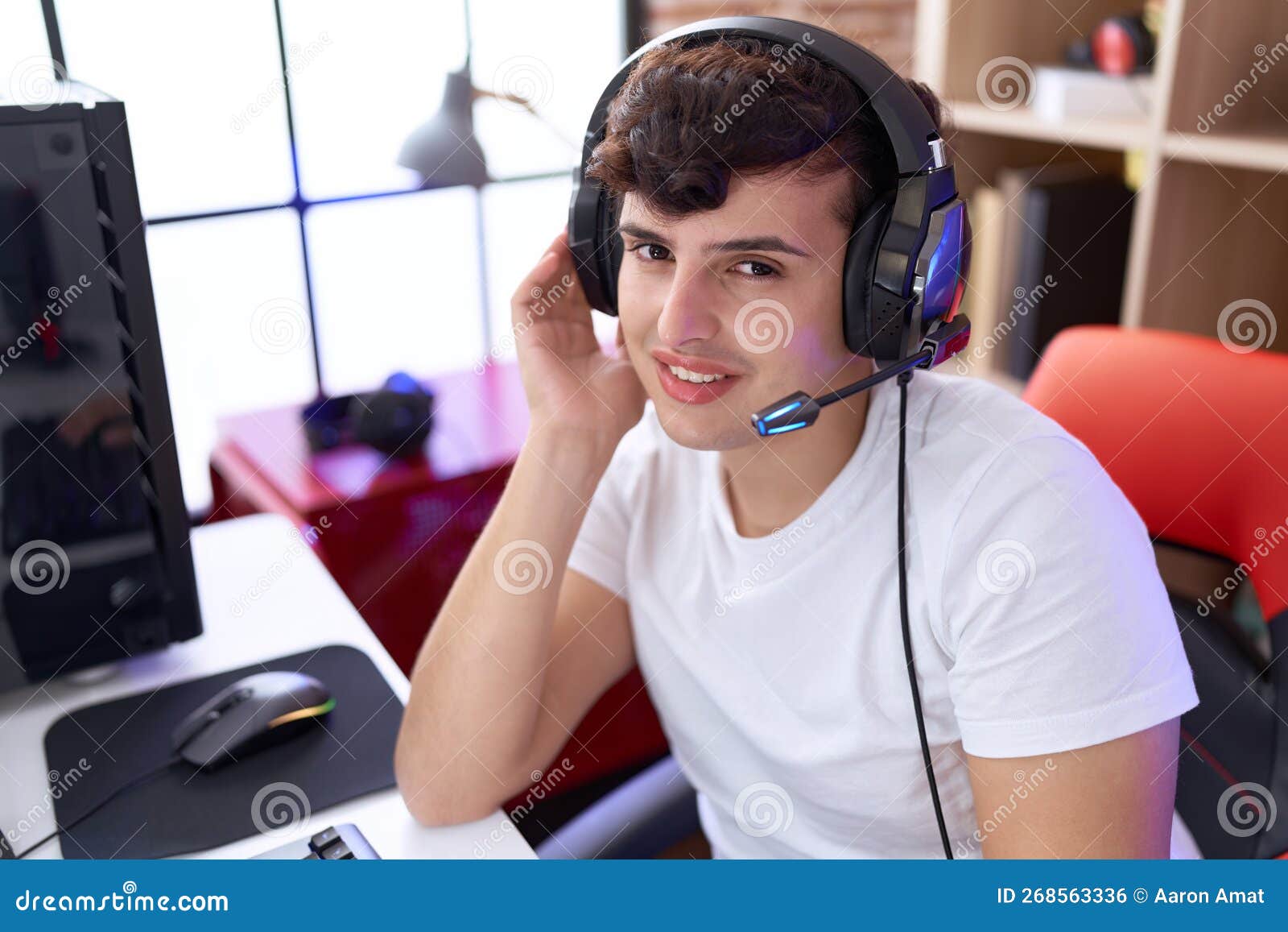 Non Binary Man Streamer Playing Video Game Using Computer at Gaming ...