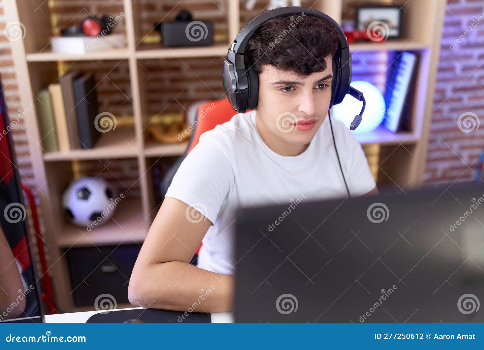 Non Binary Man Streamer Playing Video Game Using Computer at Gaming ...