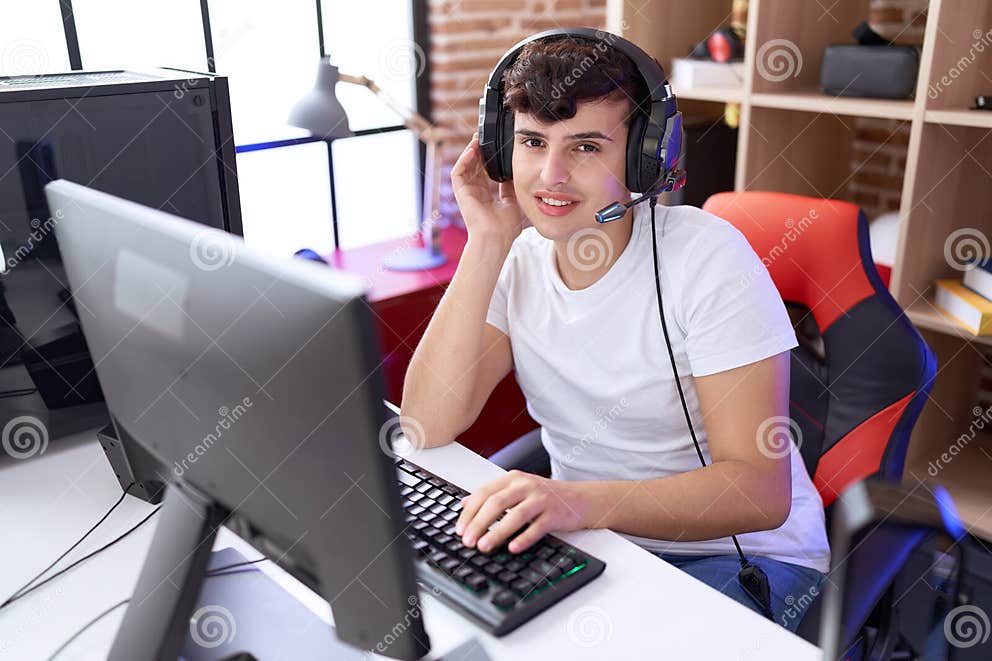 Non Binary Man Streamer Playing Video Game Using Computer at Gaming ...