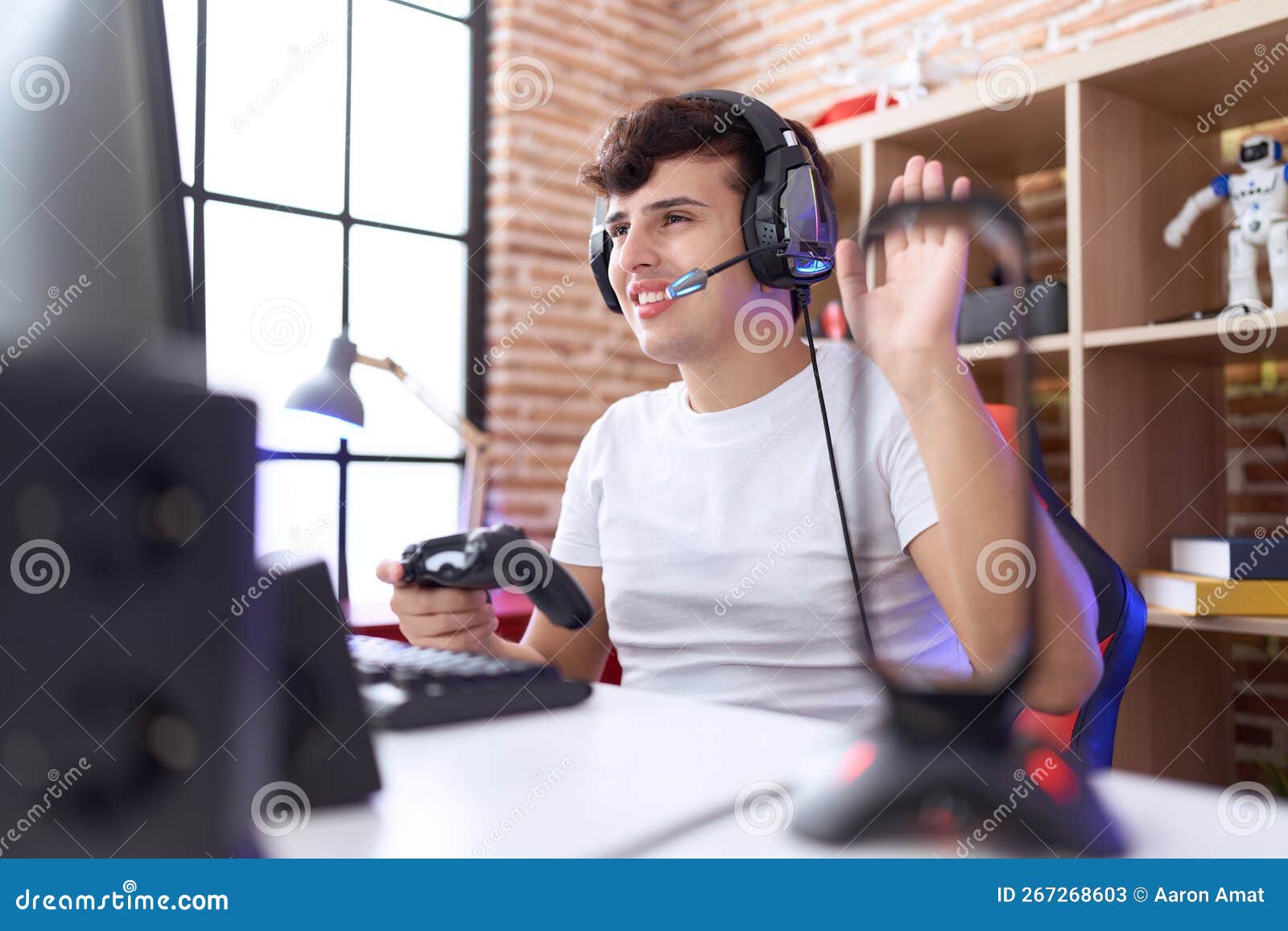 Non Binary Man Streamer Playing Video Game Using Joystick at Gaming ...