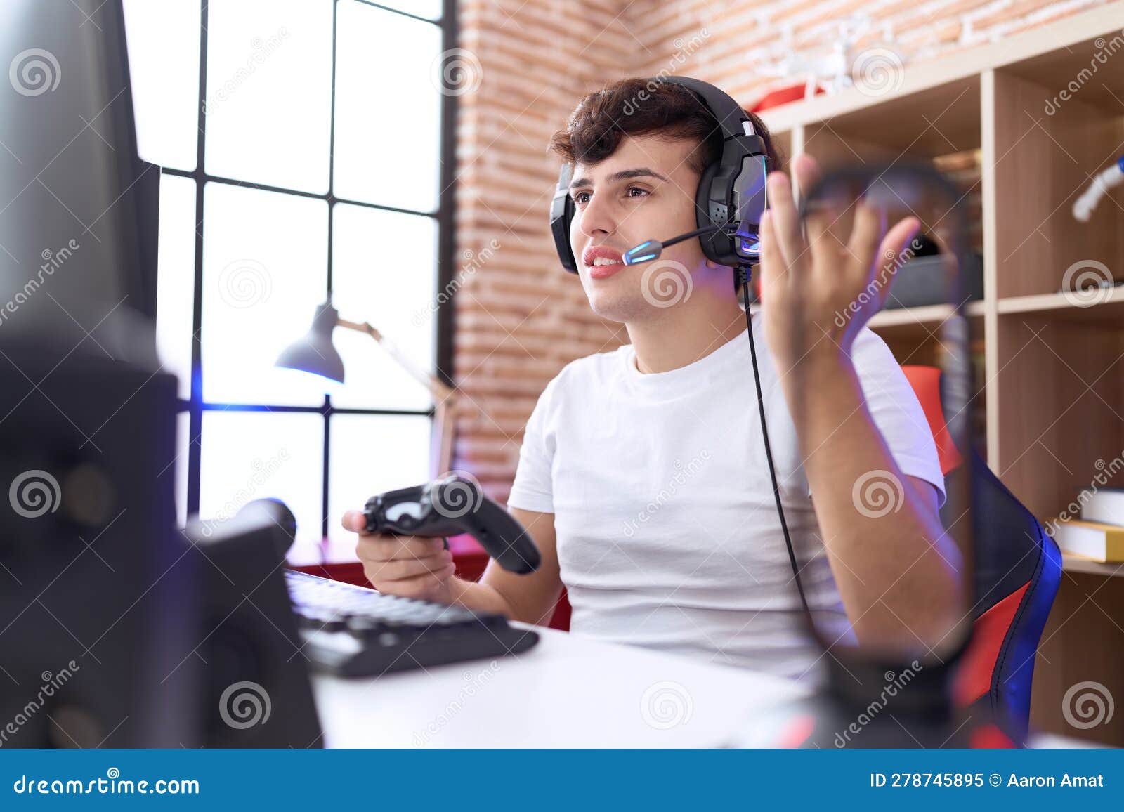 Non Binary Man Streamer Playing Video Game Using Joystick at Gaming ...