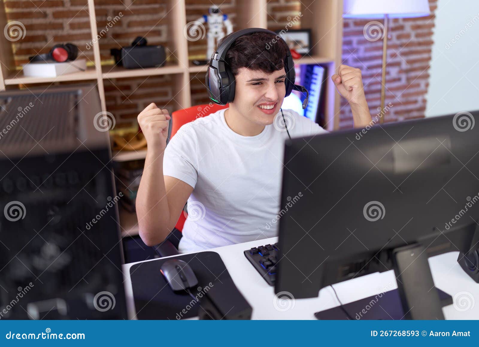 Non Binary Man Streamer Playing Video Game with Winner Expression at ...