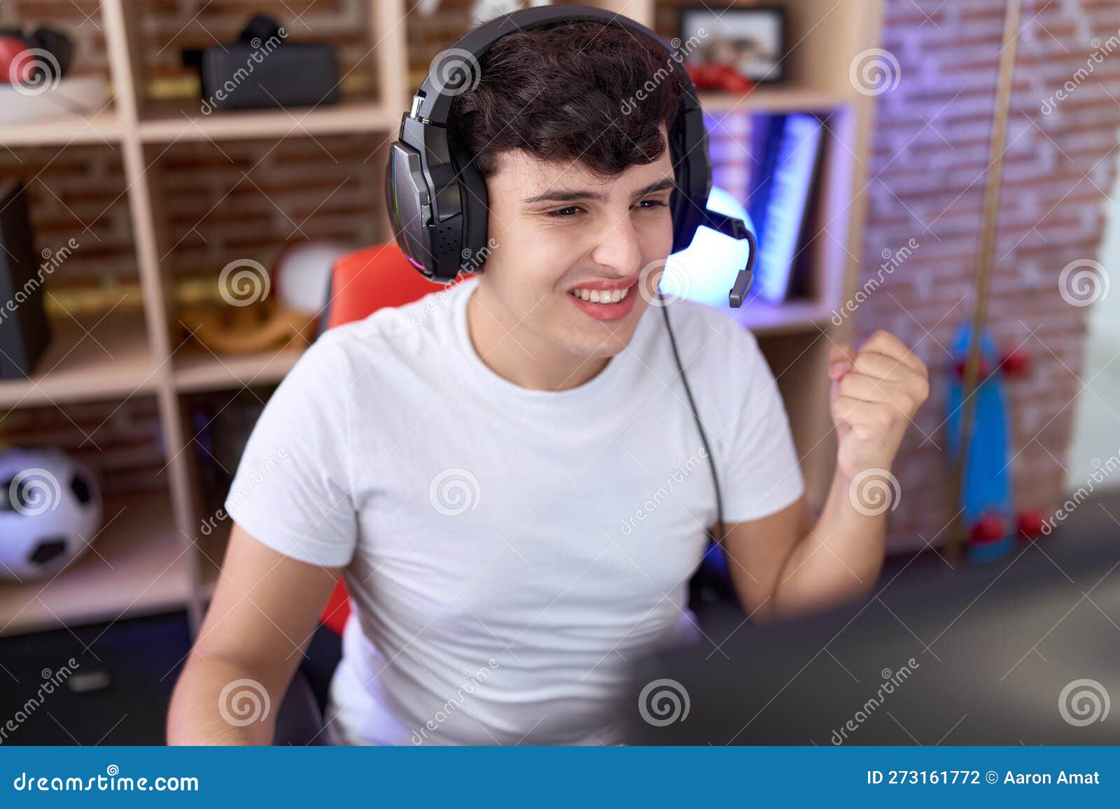 Non Binary Man Streamer Playing Video Game with Winner Expression at ...