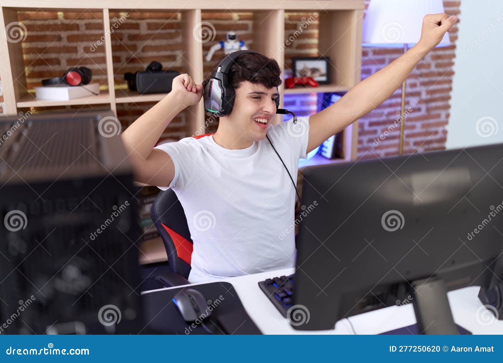 Non Binary Man Streamer Playing Video Game with Winner Expression at ...