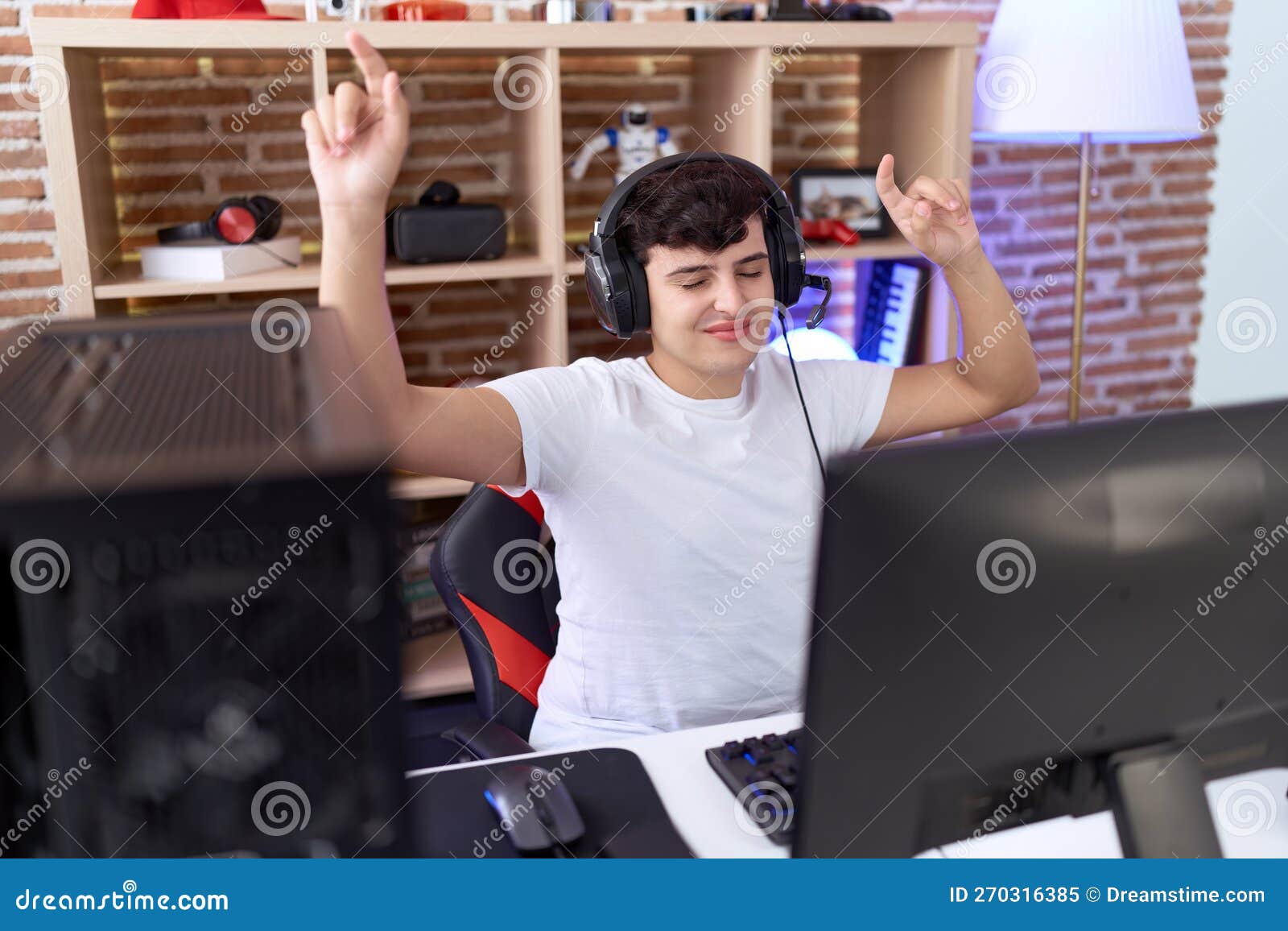 Non Binary Man Streamer Playing Video Game with Winner Expression at ...