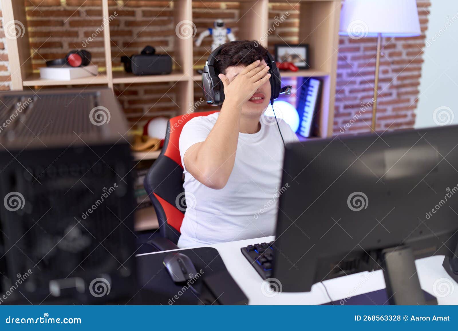 Non Binary Man Streamer Stressed Using Computer at Gaming Room Stock ...