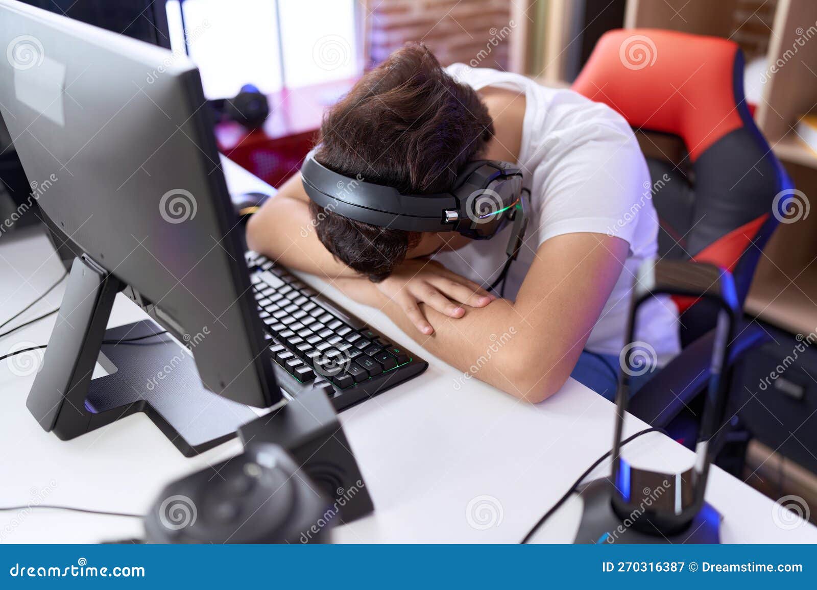 Non Binary Man Streamer Stressed Using Computer at Gaming Room Stock ...