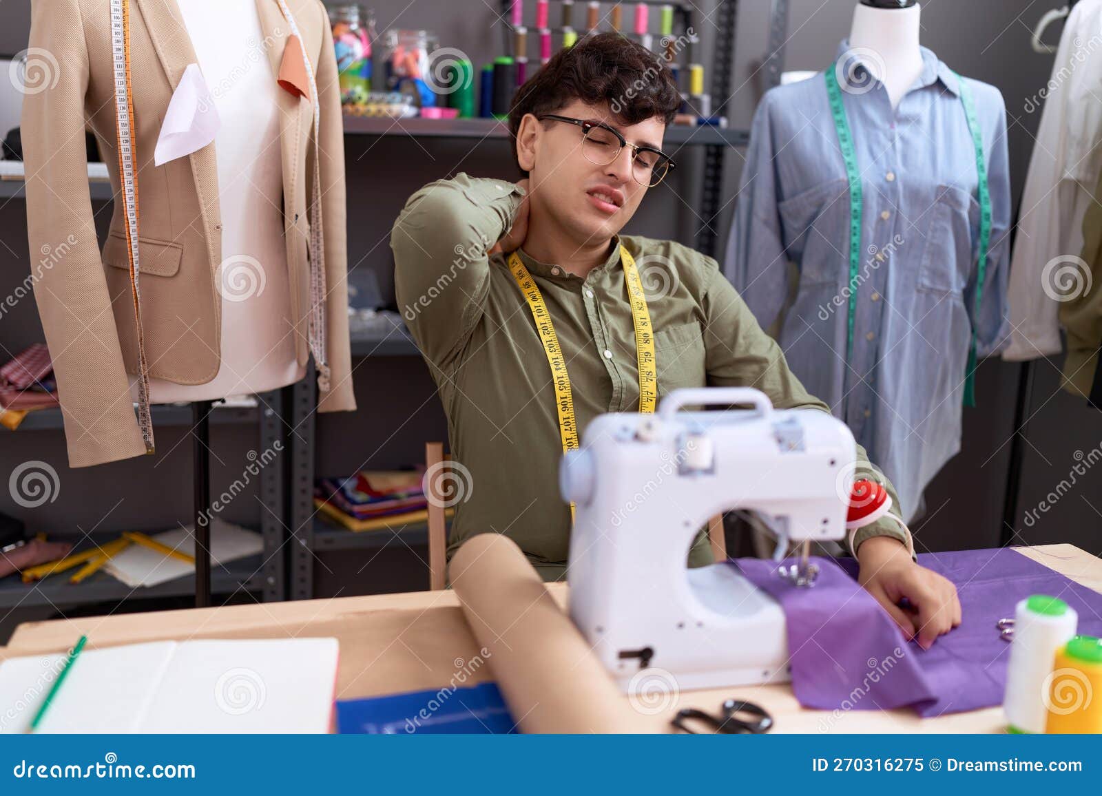 Non Binary Man Tailor Stressed Using Sewing Machine at Atelier Stock ...