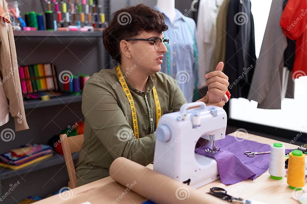 Non Binary Man Tailor Stressed Using Sewing Machine Suffering for Wrist ...