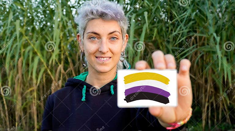 Non-binary Person Claims Gender Identity with a Non Binary Flag Stock ...