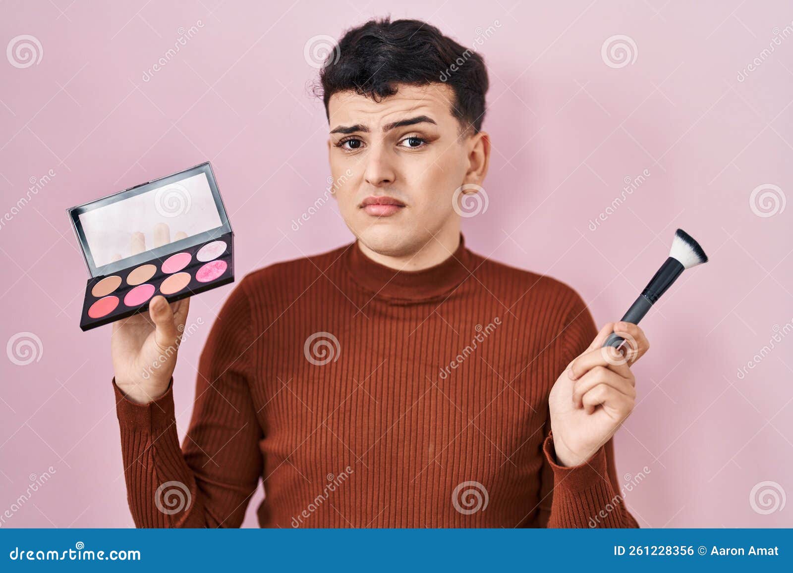 Non Binary Person Holding Makeup Brush and Blush Clueless and Confused ... Non Binary Person Holding Makeup Brush and Blush Clueless and Confused ...
