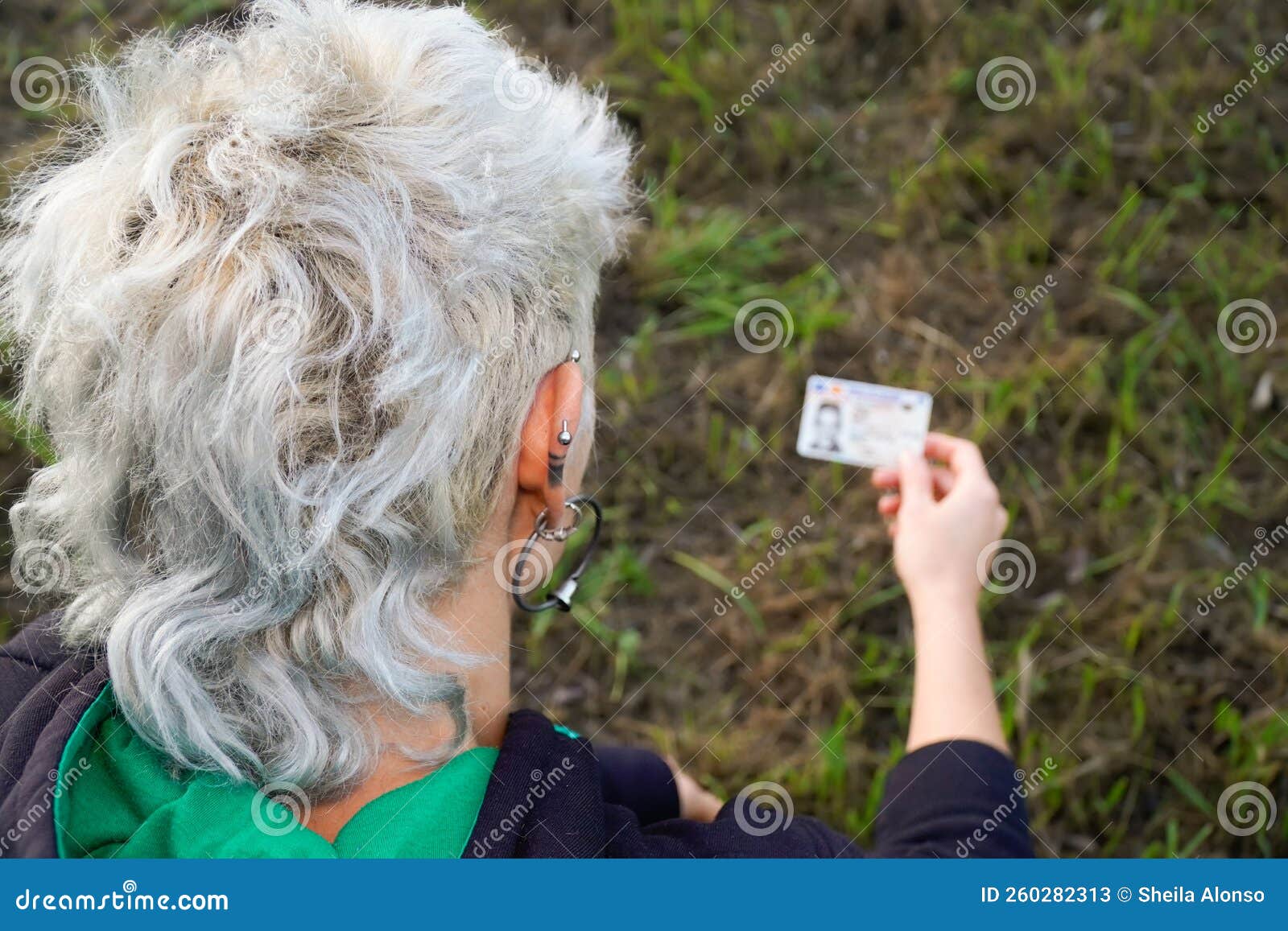Non-binary Person Looking at Their New Name on the Identity Card. Rear ...