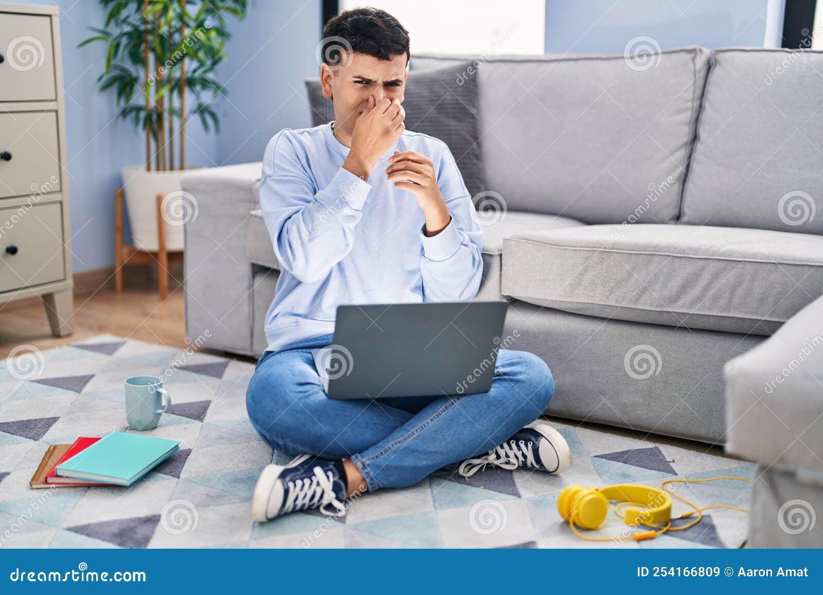 Non Binary Person Studying Using Computer Laptop Sitting on the Floor ...