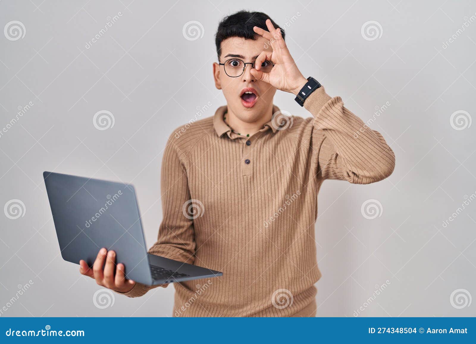 Non Binary Person Using Computer Laptop Doing Ok Gesture Shocked with ...