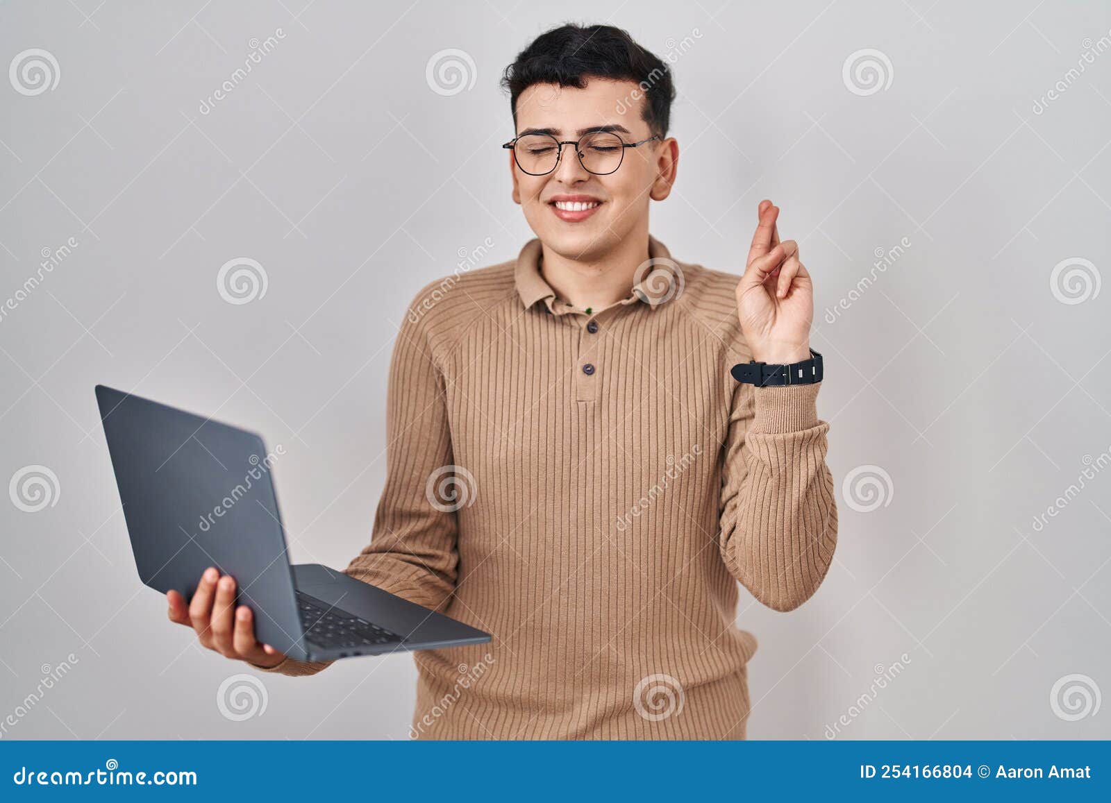 Non Binary Person Using Computer Laptop Gesturing Finger Crossed ...