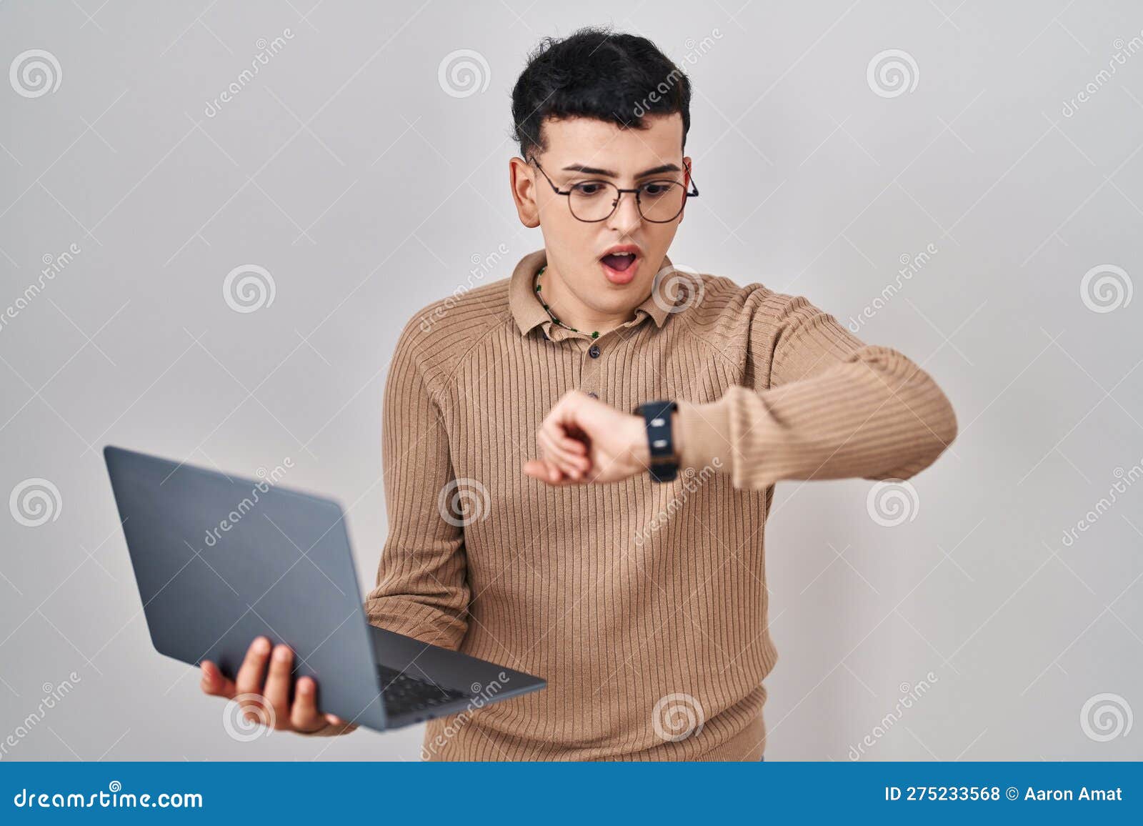 Non Binary Person Using Computer Laptop Looking at the Watch Time ...