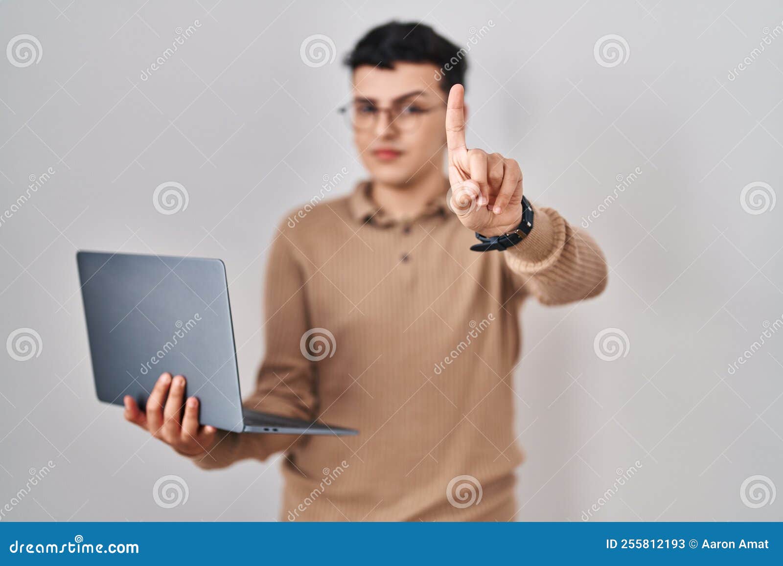 Non Binary Person Using Computer Laptop Pointing with Finger Up and ...