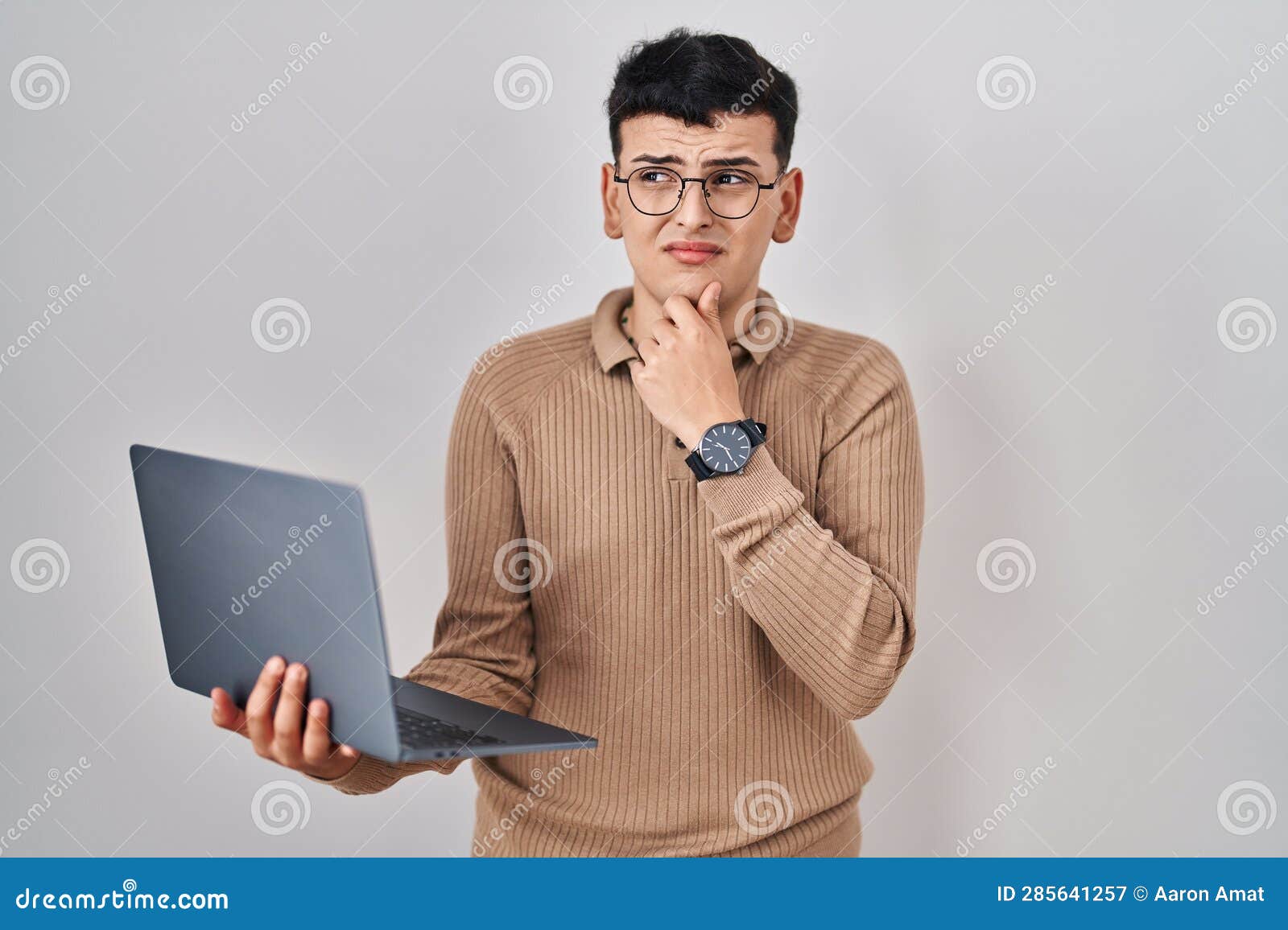 Non Binary Person Using Computer Laptop Thinking Worried about a ...
