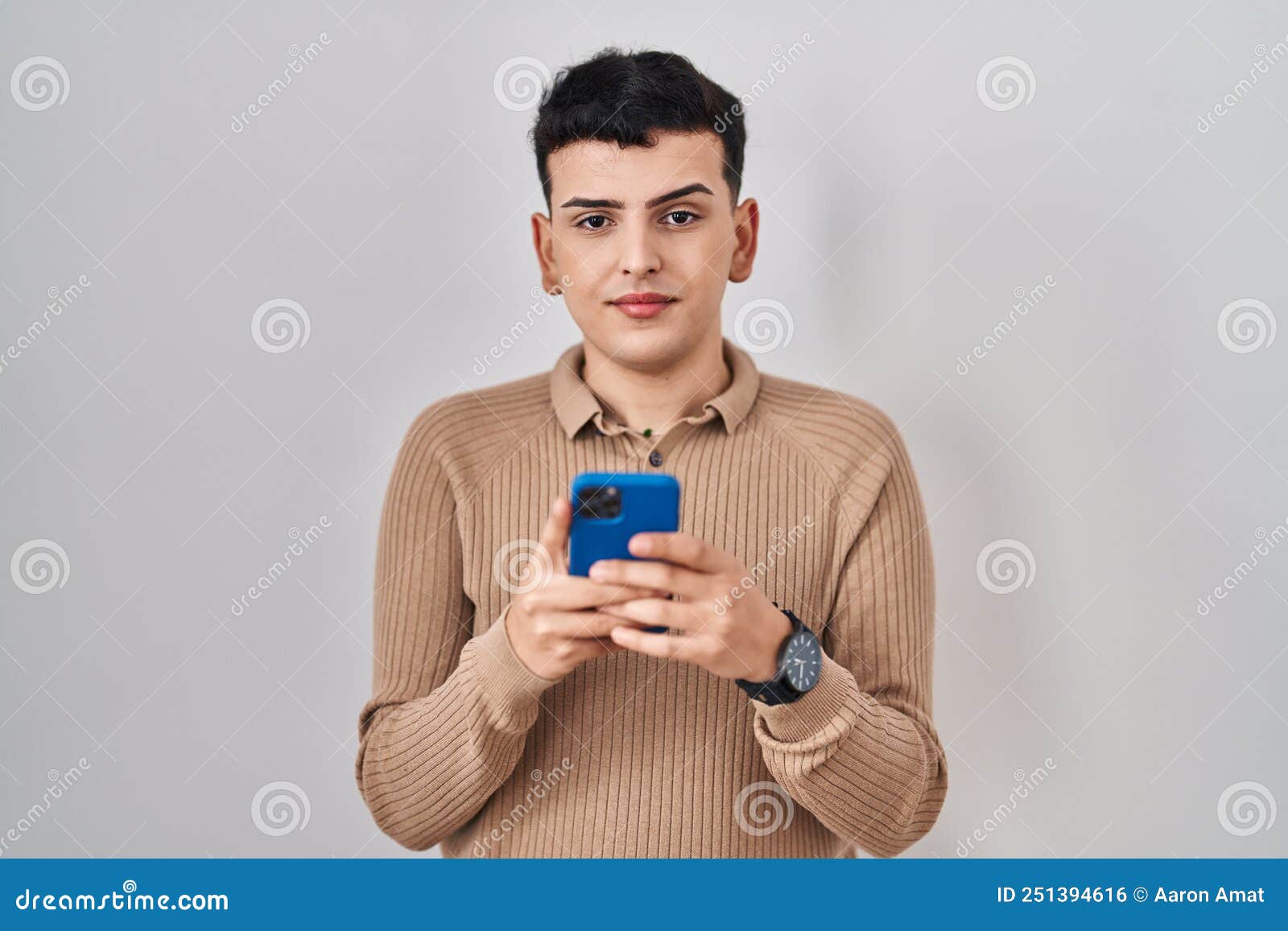 Non Binary Person Using Smartphone Typing Message Relaxed with Serious ...