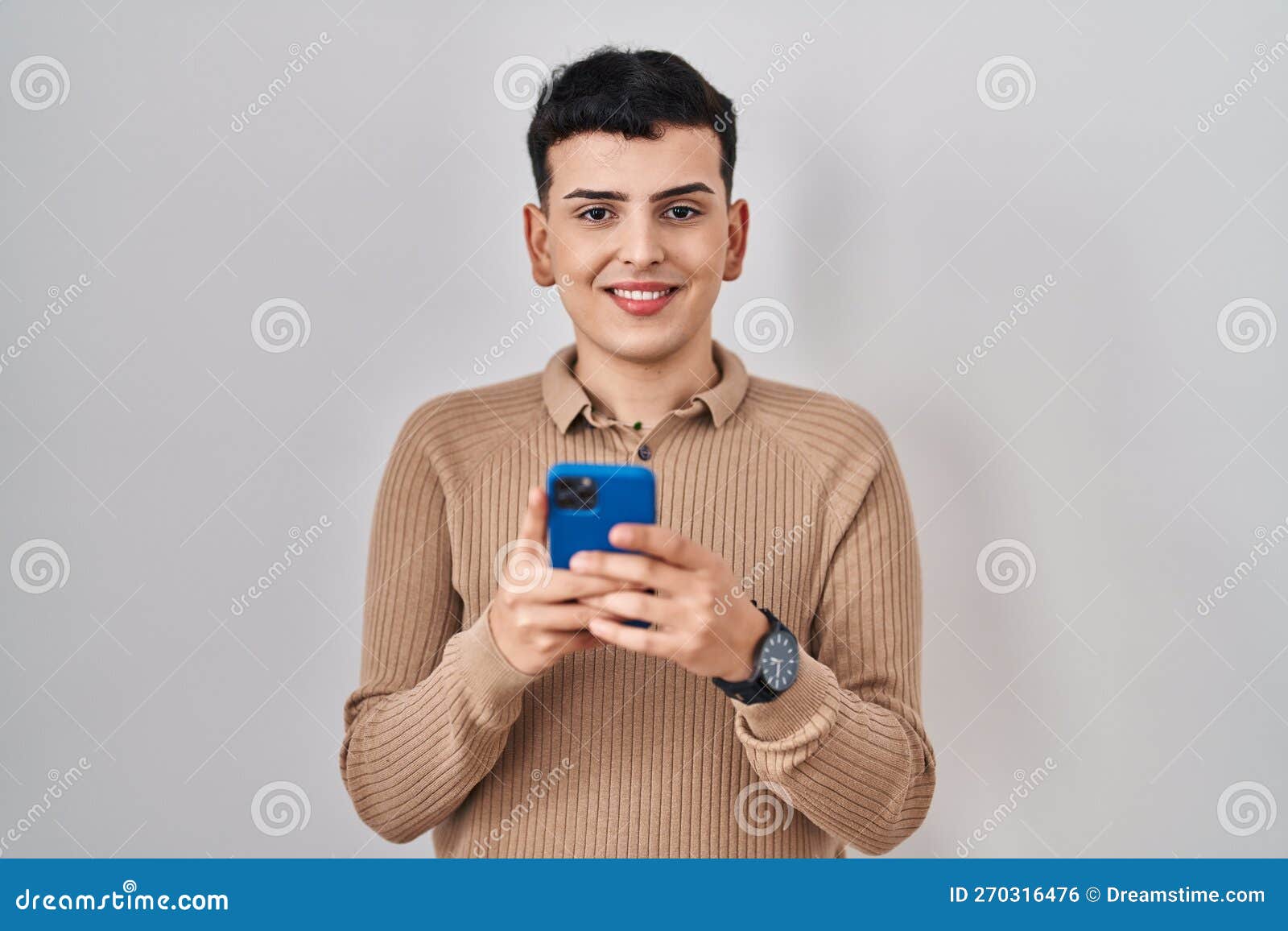 Non Binary Person Using Smartphone Typing Message Smiling with a Happy ...