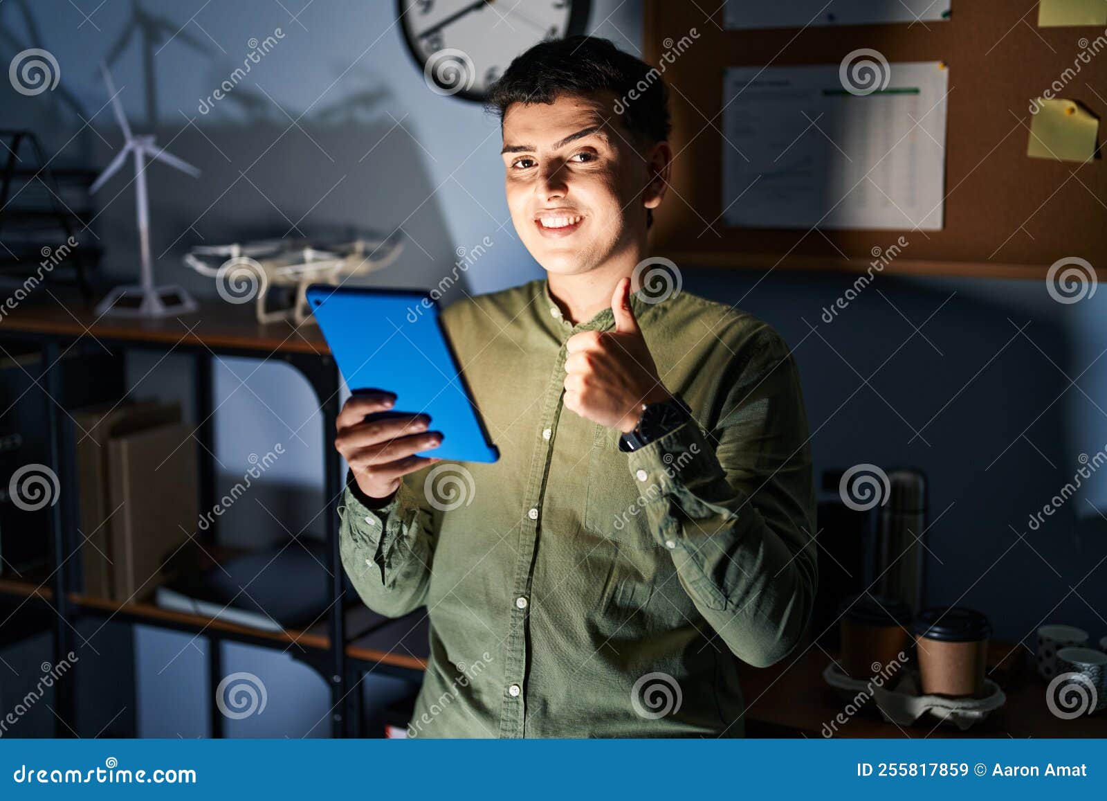 Non Binary Person Using Touchpad Device at Night Doing Happy Thumbs Up ...