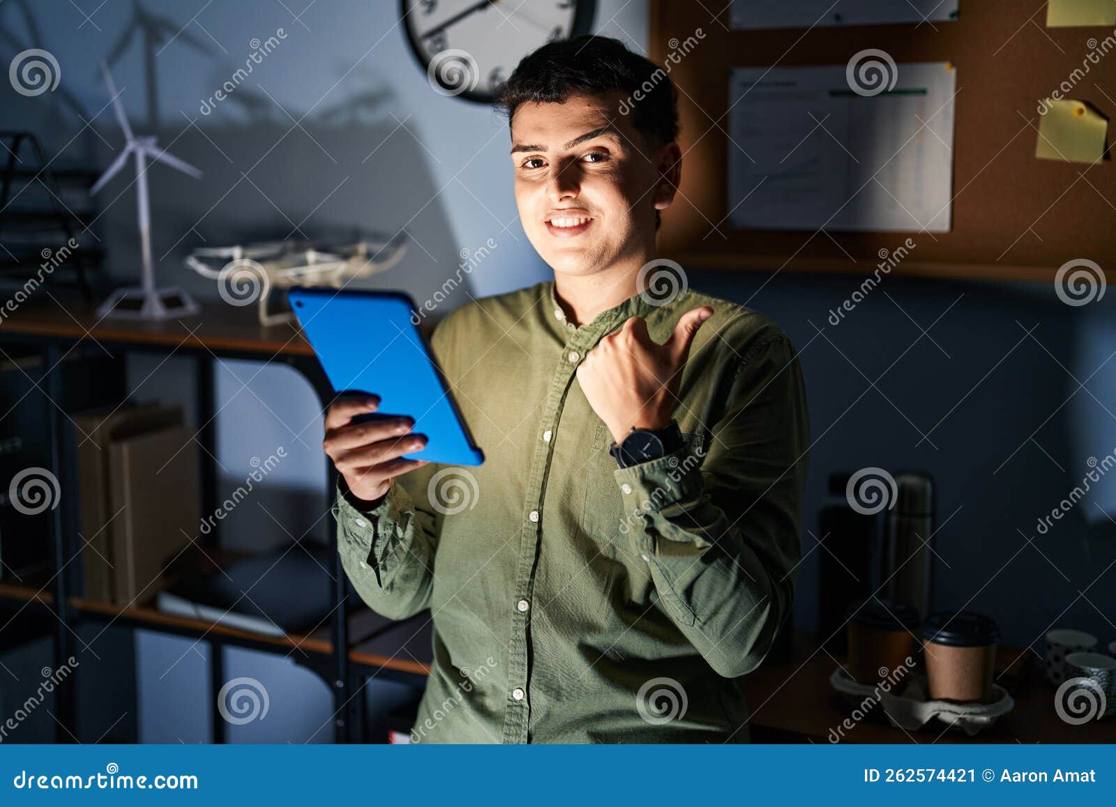Non Binary Person Using Touchpad Device at Night Pointing To the Back ...