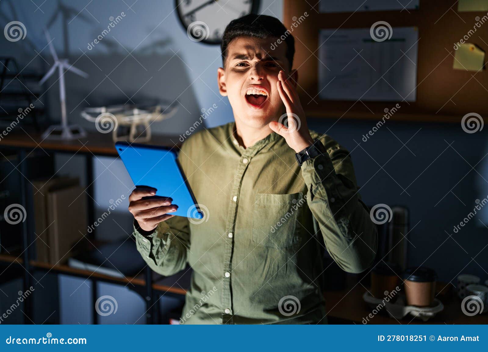 Non Binary Person Using Touchpad Device at Night Shouting and Screaming ...