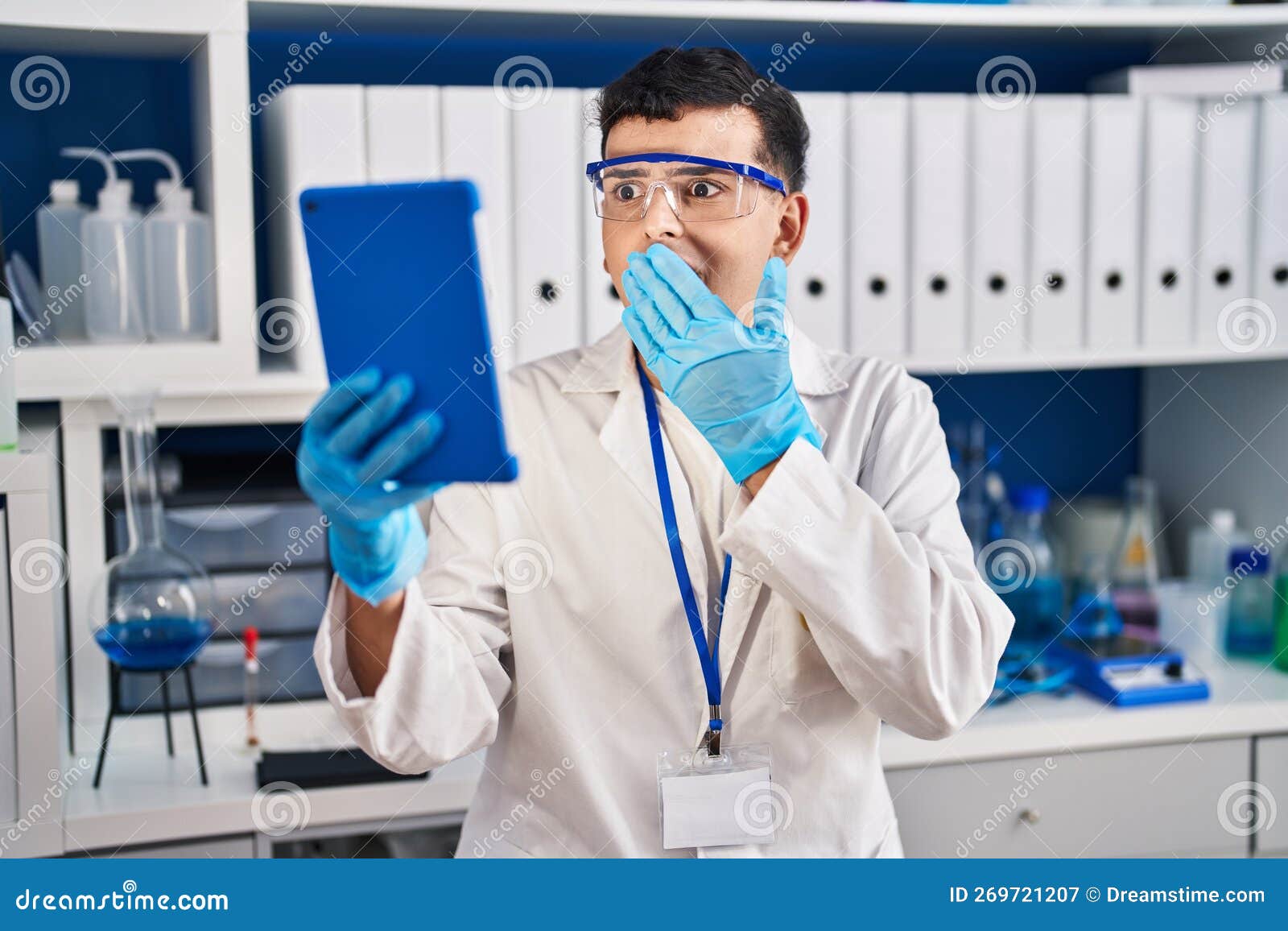 Non Binary Person Working at Scientist Laboratory Using Tablet Covering ...
