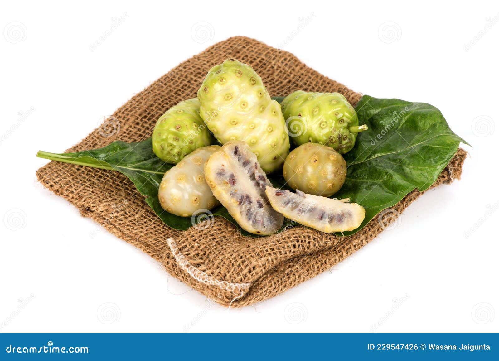 Noni Fruits and Green Leaf Isolated on White Surface Stock Photo ...
