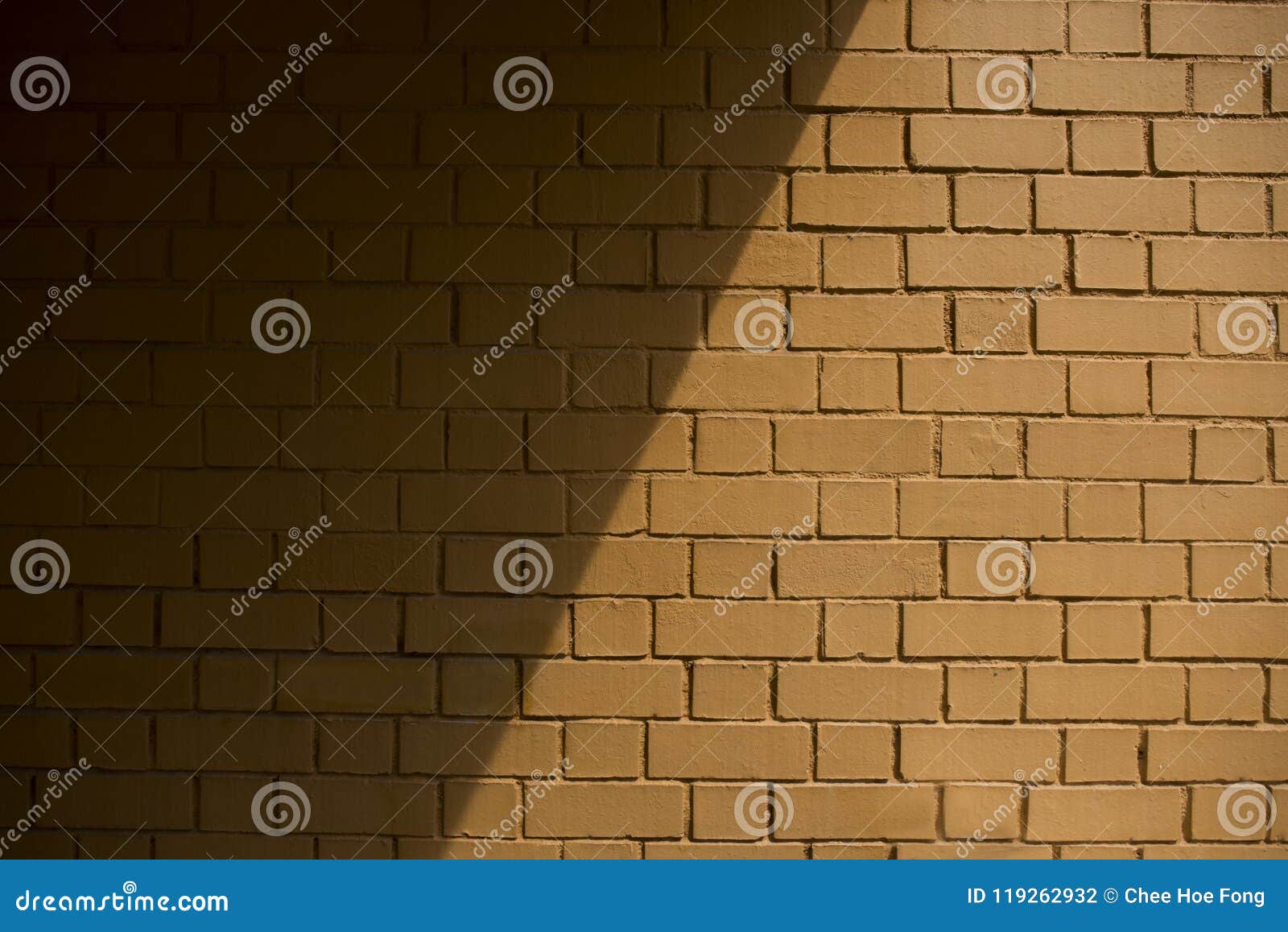 A Noon Shadow Casting on a Brown Brick Wall Stock Photo - Image of ...