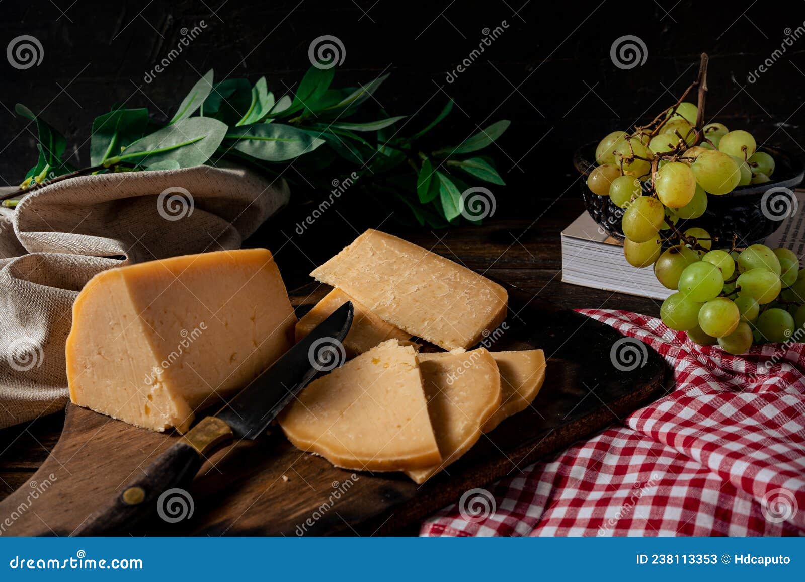 Normal View of a Piece of Provolone Cheese Cut on a Board and Some ...