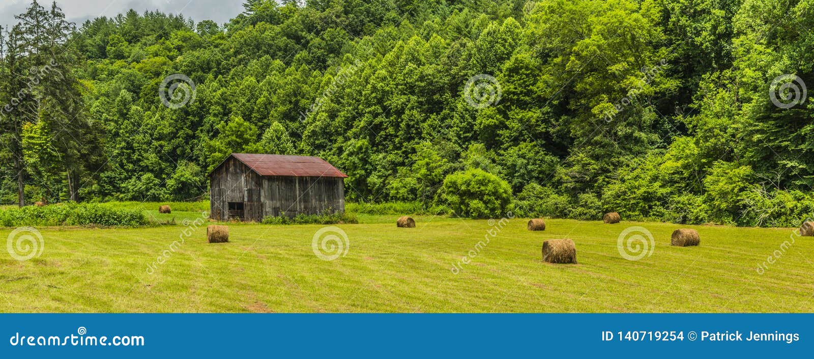 North Carolina Barn with Round Bales in Field 1 Stock Photo - Image of ...
