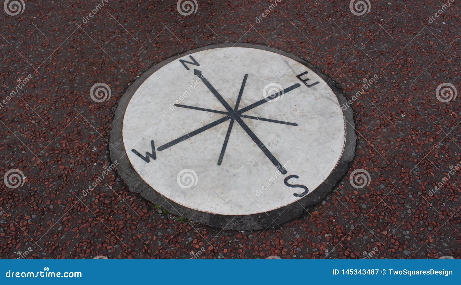 Big compass in the ground stock image. Image of west - 145343487