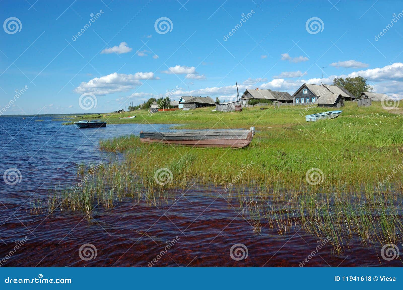 Northern Russian Village by the Lake Stock Photo - Image of field ...