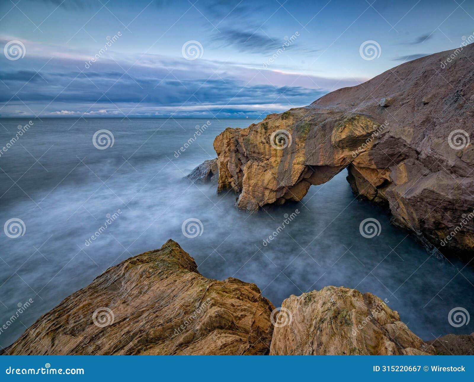Northumberland Coast with a Distant Cliff in the Backdrop Stock Image ...