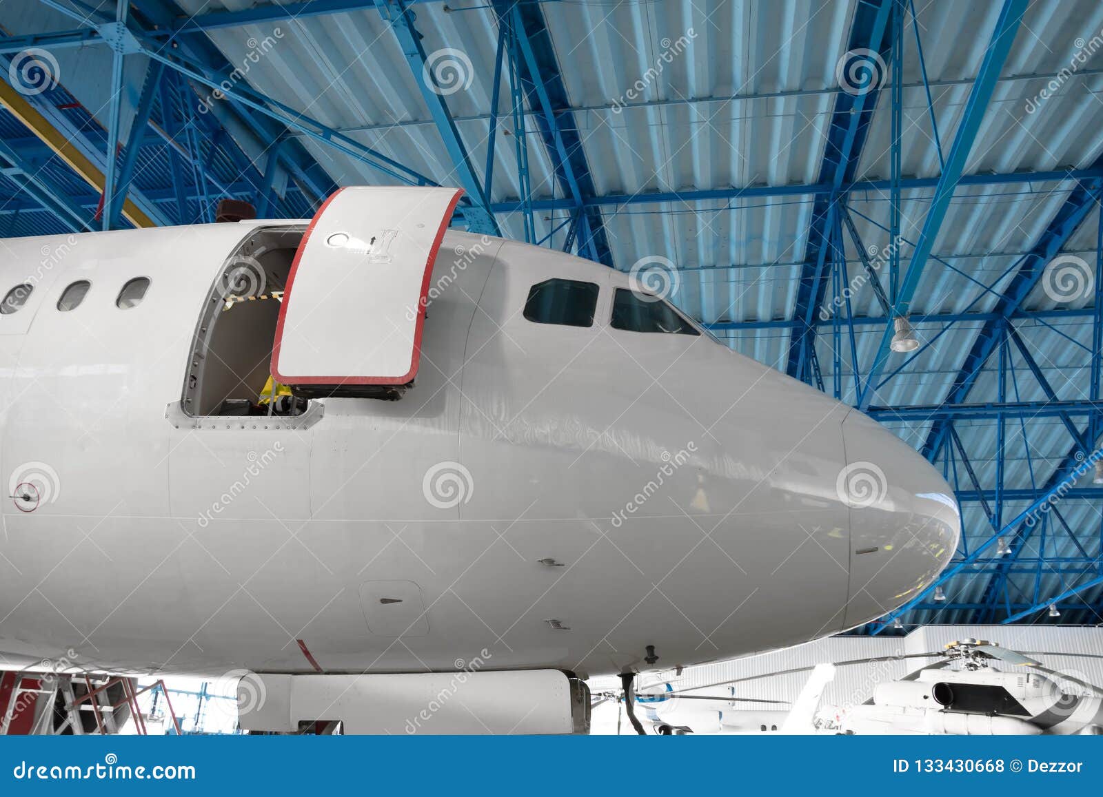 The Nose Of The Aircraft Fuselage With Open Door In The Aircraft Hangar ...