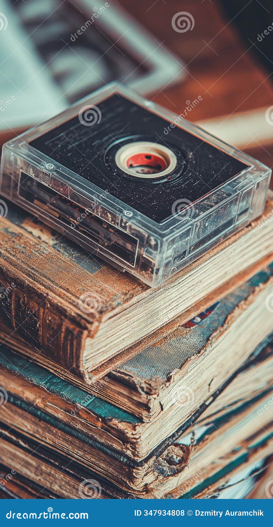 A Nostalgic Cassette Tape on a Stack of Aged Books in an Inviting ...