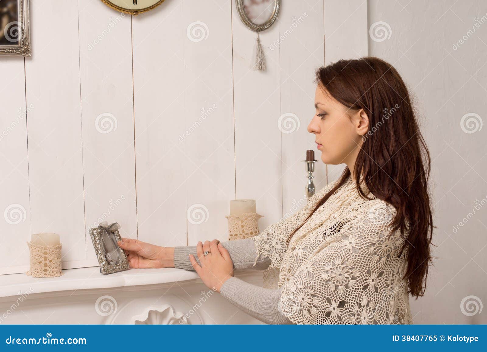 Nostalgic Young Woman Looking at an Old Portrait Stock Image - Image of ...