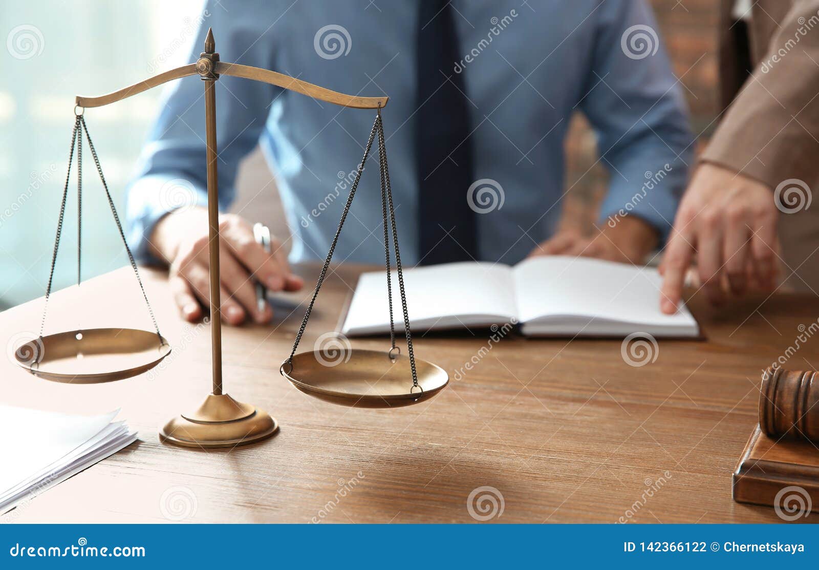 Notaries Working at Table in Office, Focus on Scales of Justice Stock ...