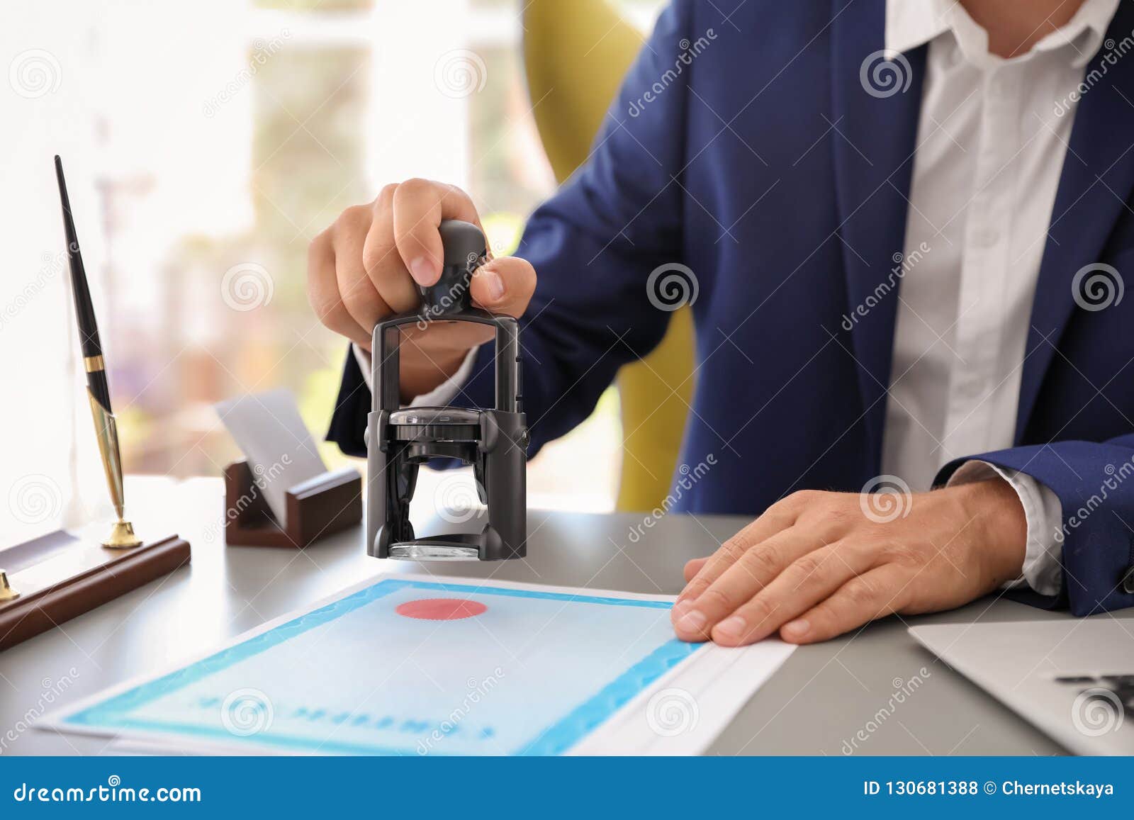 Notary Stamping Document at Desk in Office Stock Photo - Image of form ...