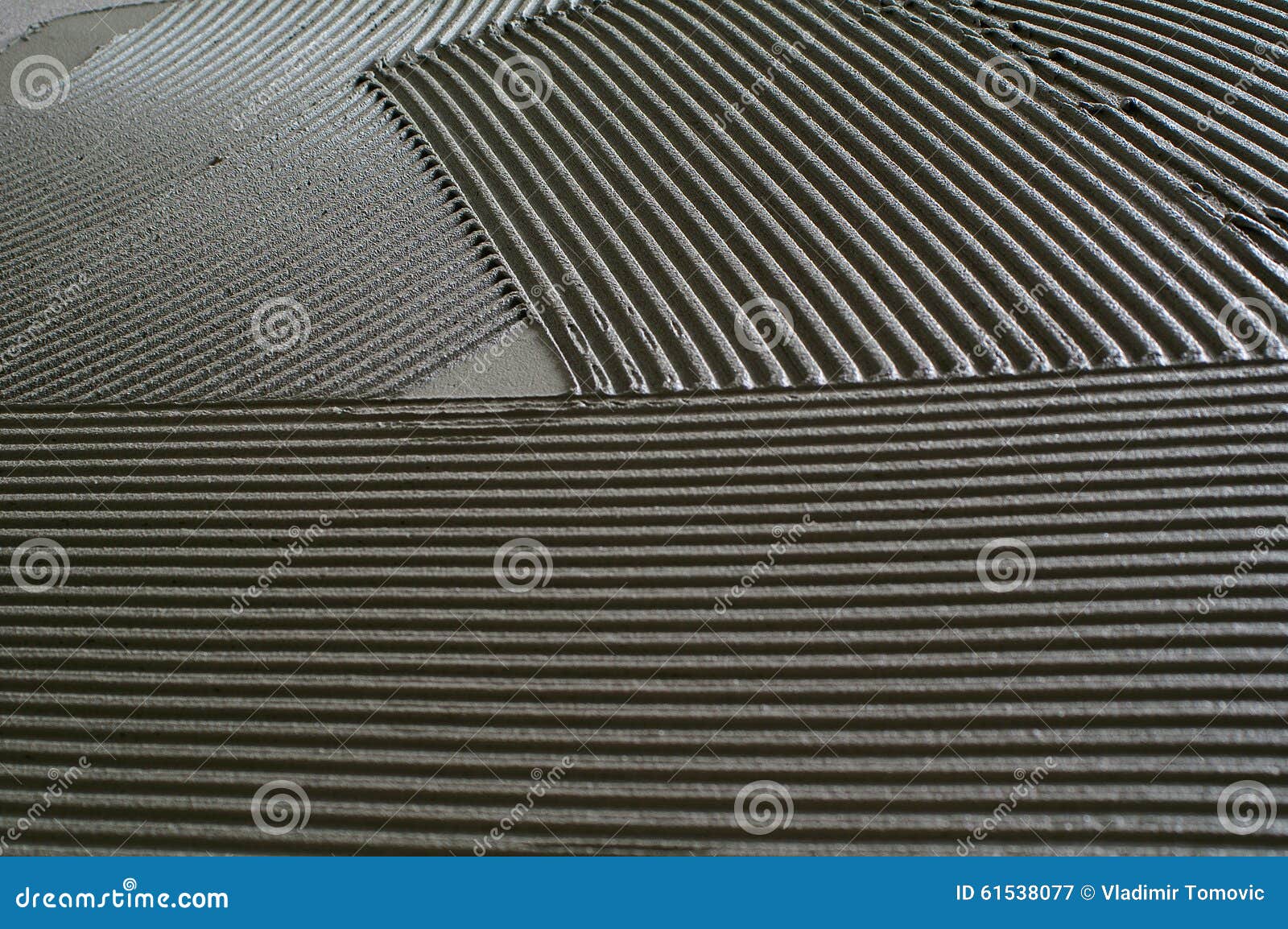Notched Troweling Mortar Onto Concrete Floor Preparation Stock Photos ...