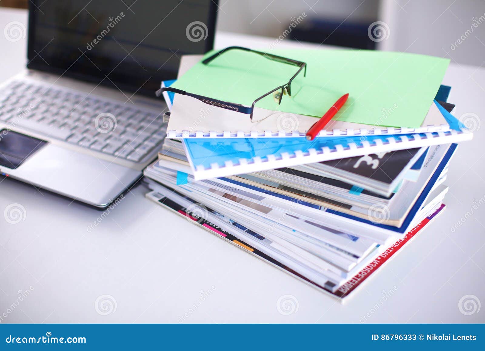 A Note Book, Laptop, Pen, Graph Paper Document on the Office Desk Table ...