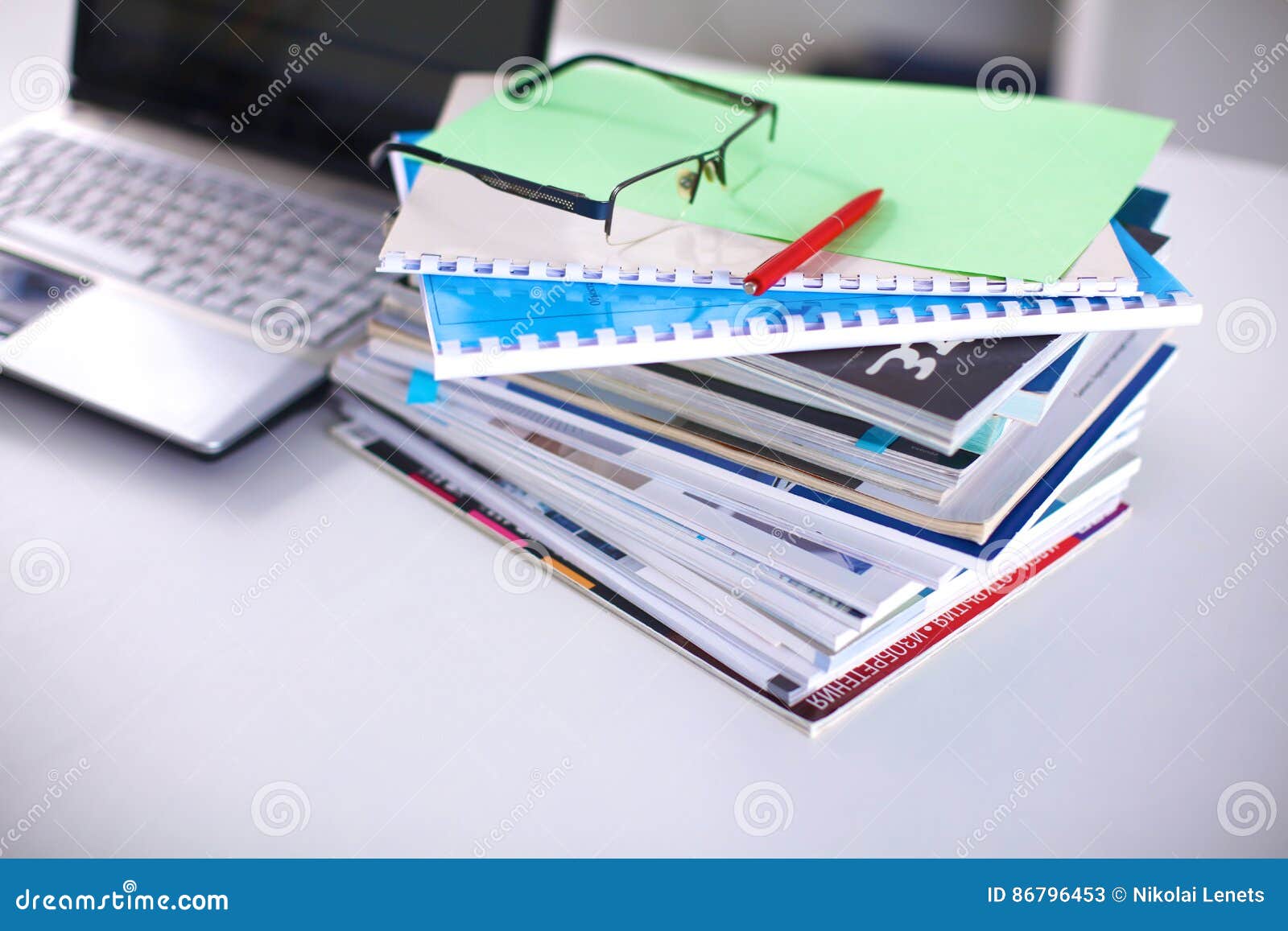 A Note Book, Laptop, Pen, Graph Paper Document on the Office Desk Table ...