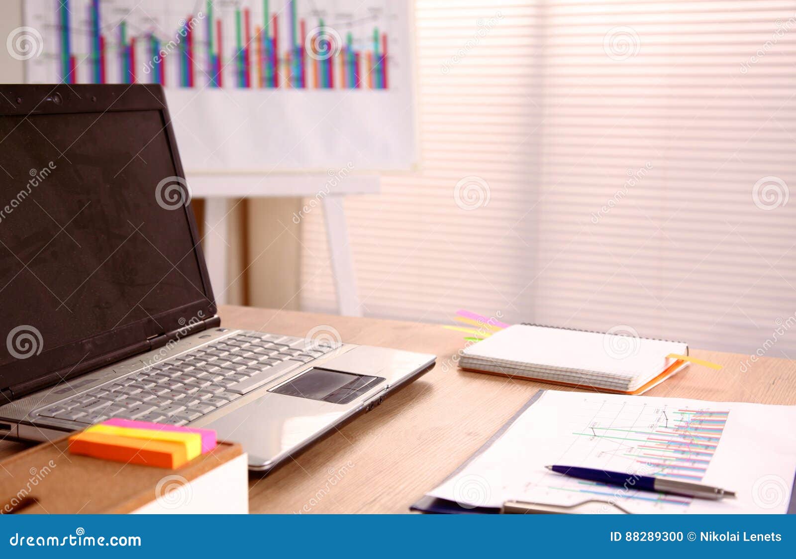 A Note Book, Laptop, Pen, Graph Paper Document on the Office Desk Table ...